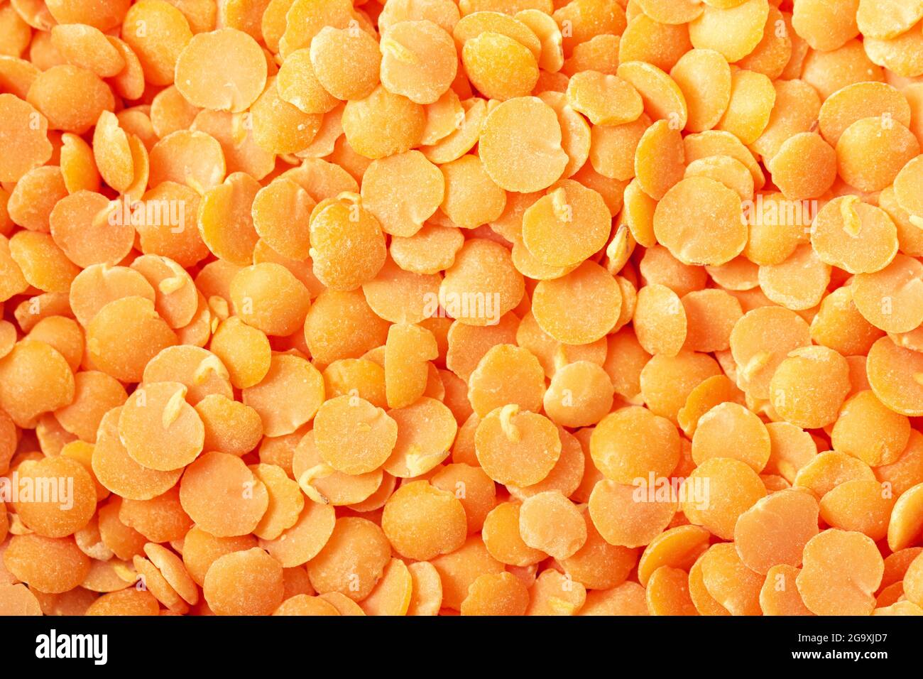 Red lentil background. Abstract food texture Stock Photo - Alamy