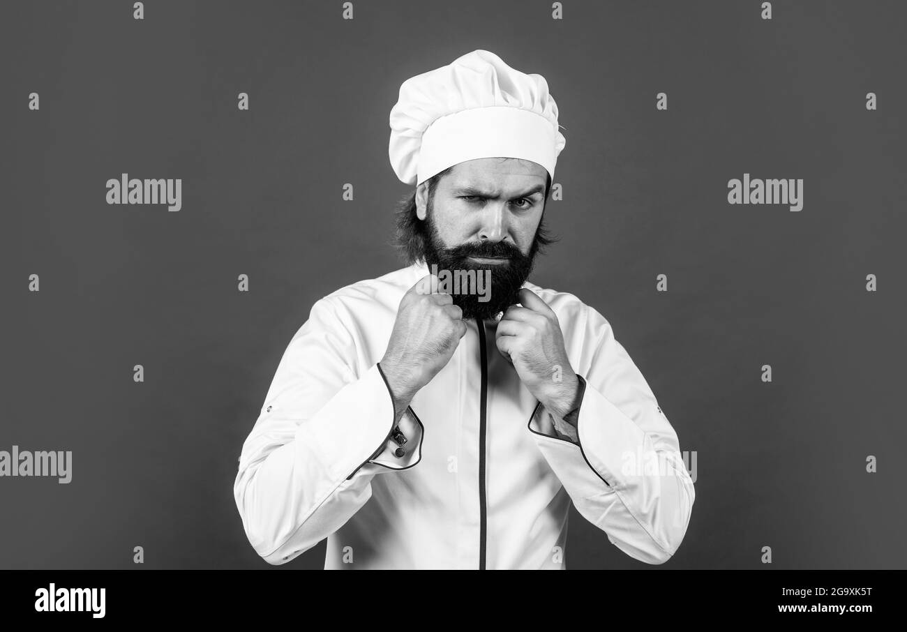 man chef in hat with beard and moustache on red background ...