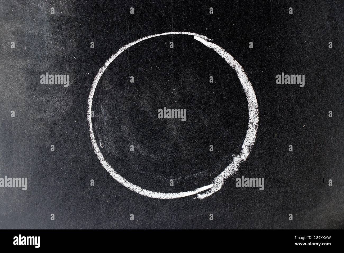 White chalk drawing in circle shape on black board background Stock ...
