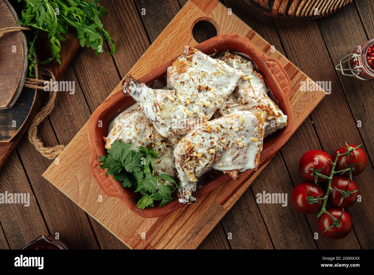 Georgian dish chkmeruli chicken with cream Stock Photo - Alamy