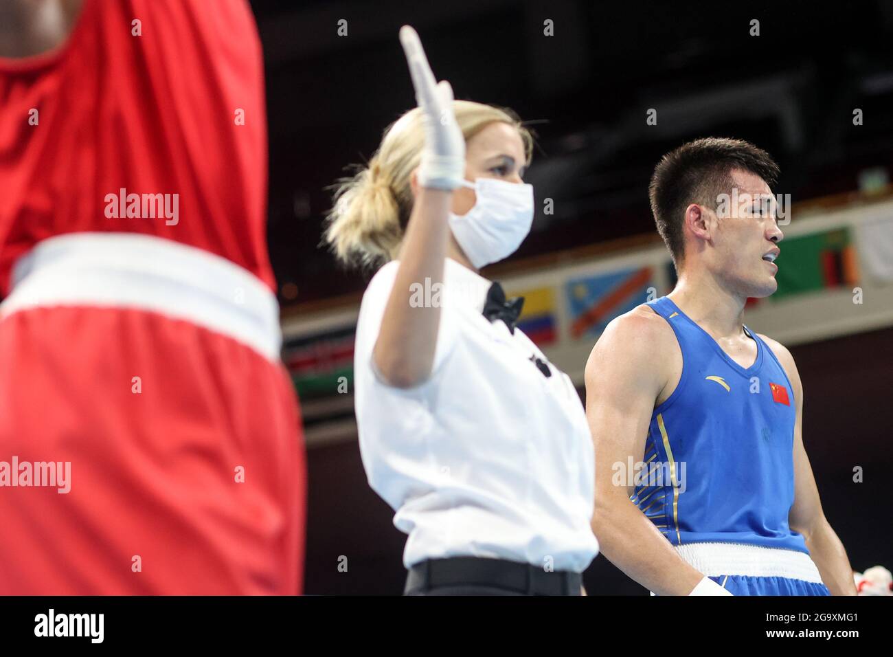 Tokyo, Japan. 28th July, 2021. Chen Daxiang (R) of China looks on after ...