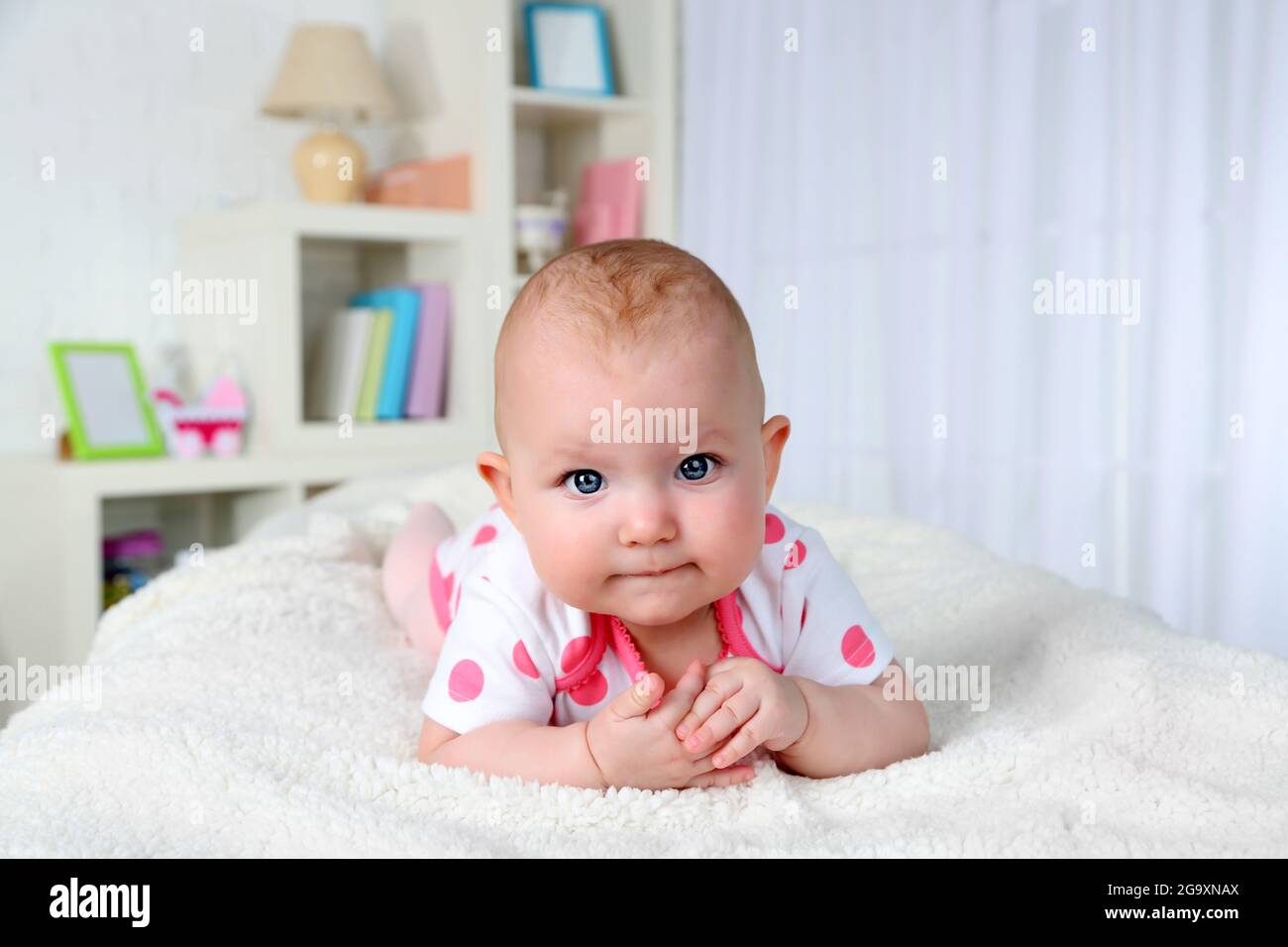 Cute baby girl, on home interior background Stock Photo - Alamy
