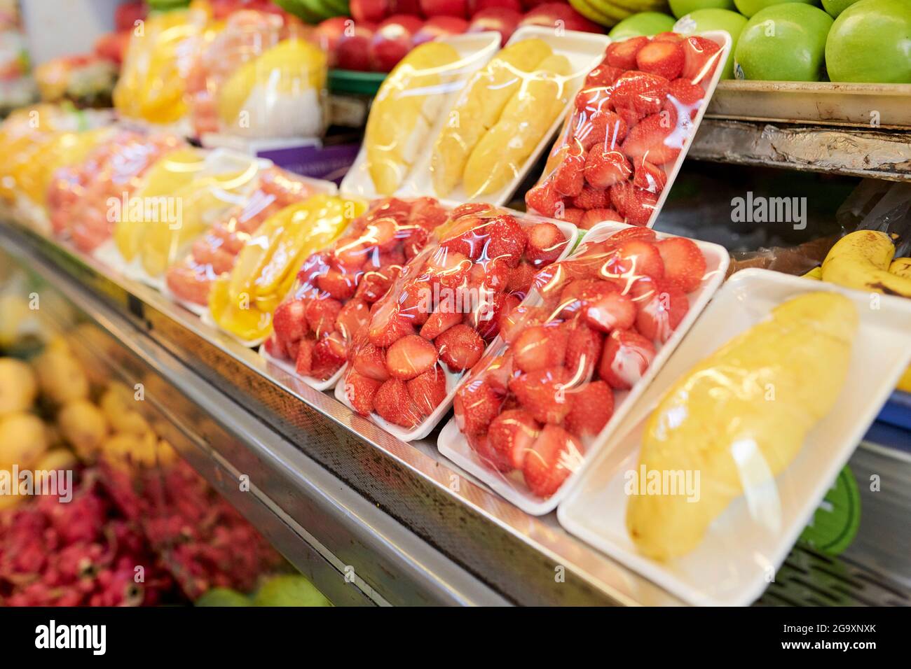 Close-up of ripe fruits packed and lying on the shelves in vegetable ...