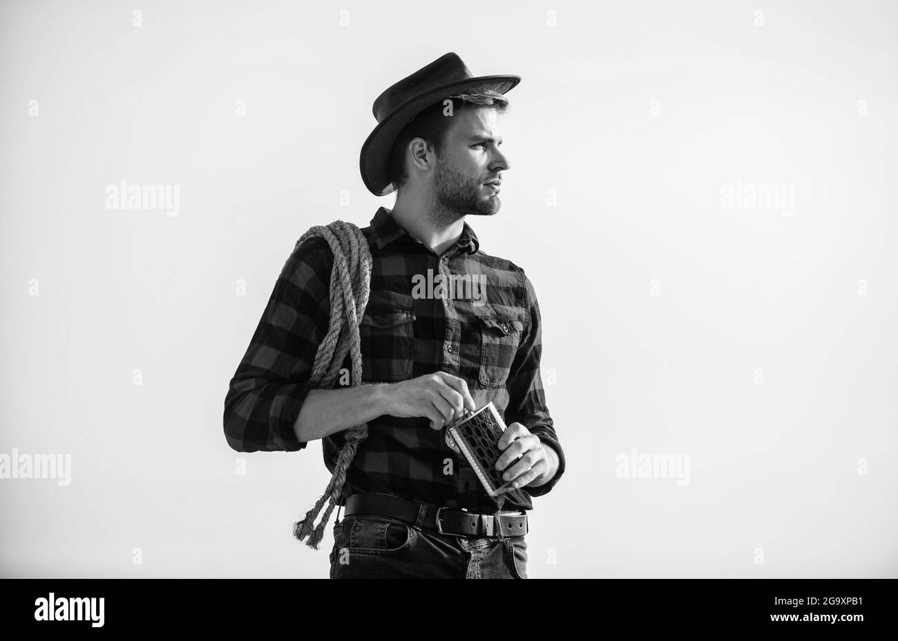 Looking for adventures. Farmer cowboy handsome man relaxing after hard ...