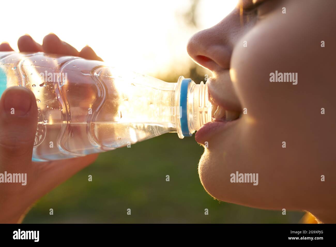 pretty woman drinking water from a bottle summer thirst Stock Photo - Alamy