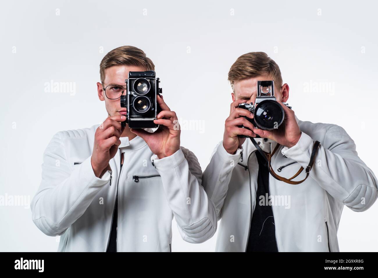 two cousin with retro photo camera. young confident brothers. confident ...