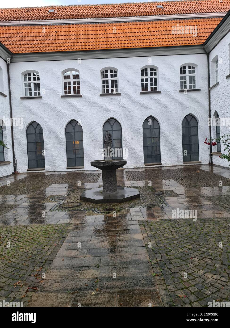 Monastery courtyard with fountain Stock Photo - Alamy