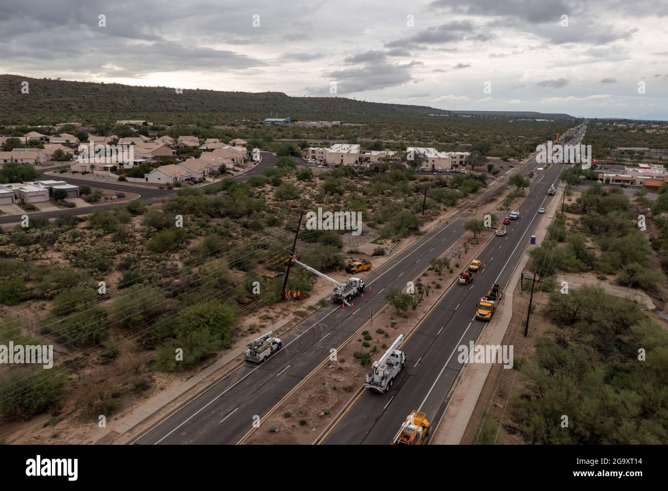 City crews fix downed power lines after storm Stock Photo - Alamy