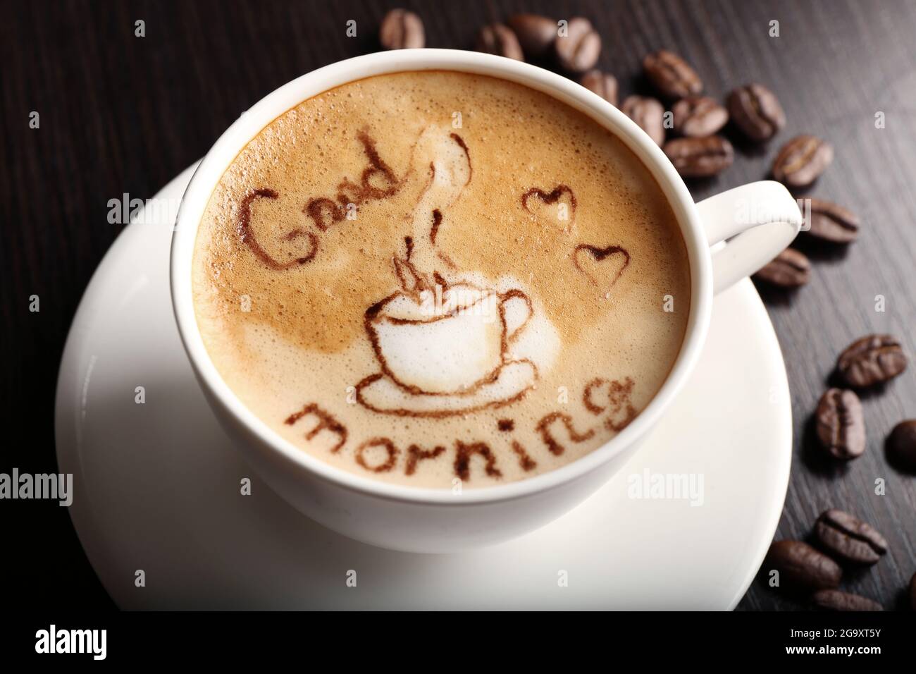 Cup of latte art coffee with grains, closeup Stock Photo - Alamy