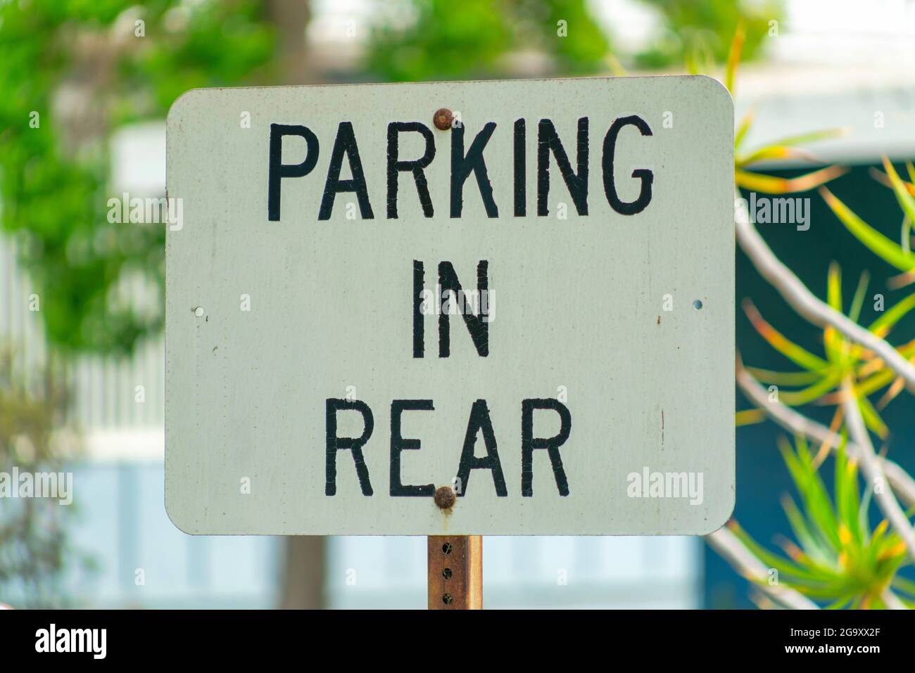 Closeup shot of a sign saying 'parking in rear' Stock Photo - Alamy