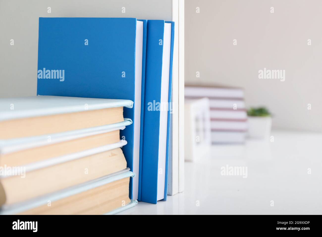 Different books on shelf, closeup Stock Photo - Alamy