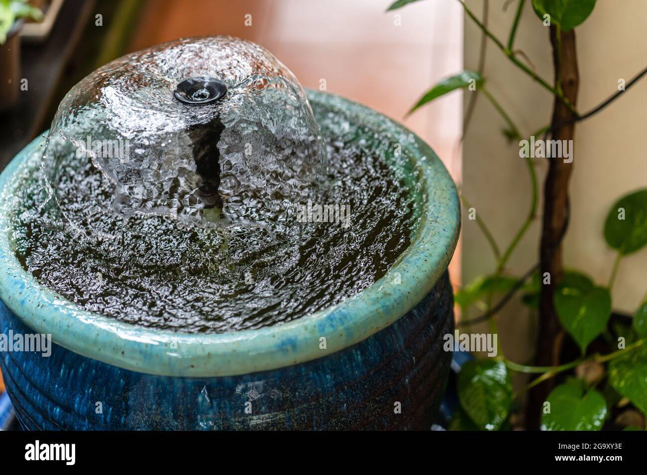 Colorful ceramic jar with small water fountain Stock Photo - Alamy