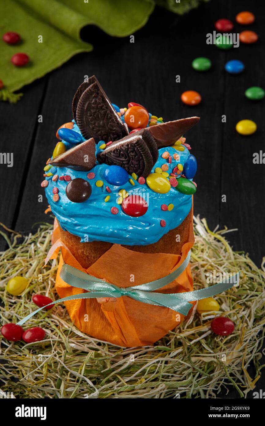 Easter cake with blue whipped egg whites icing and sweets Stock Photo ...