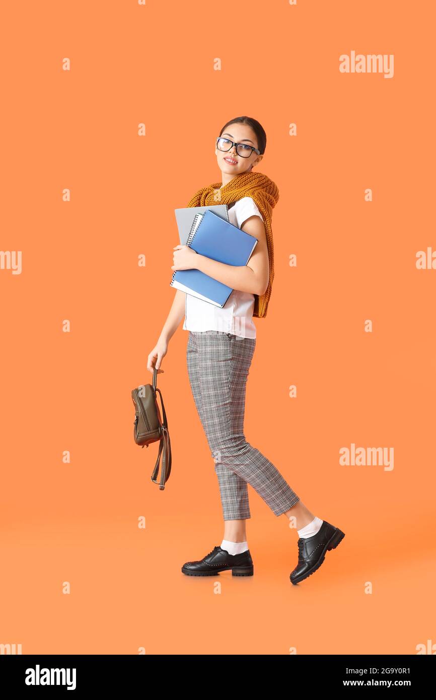 Female student on color background Stock Photo - Alamy