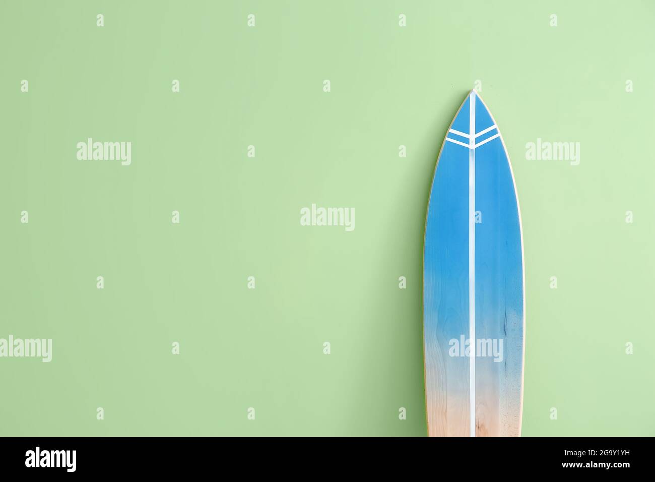 Blue surfboard on color background Stock Photo - Alamy