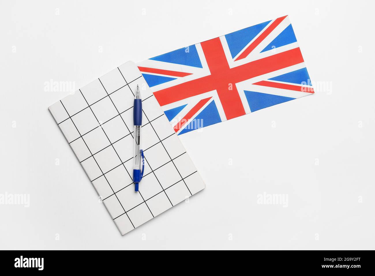 Notebook, pen and UK flag on white background. Concept of learning ...
