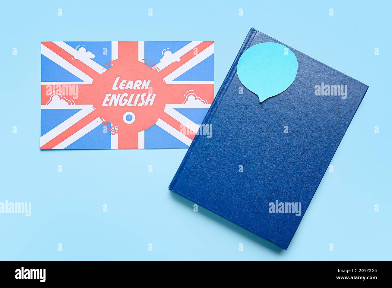 Notebook and UK flag on color background. Concept of learning English ...