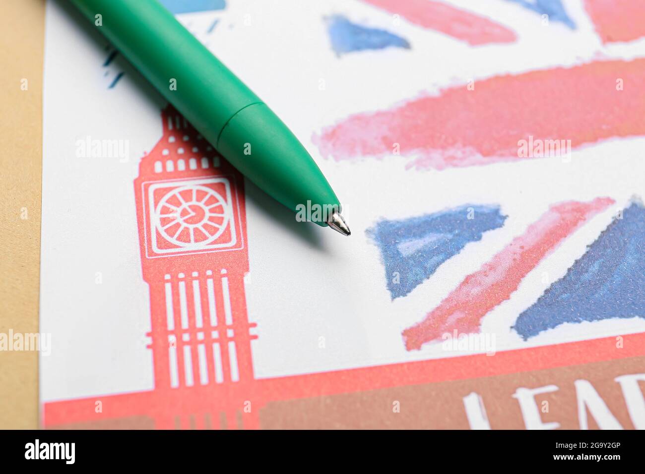 Pen and paper with picture of UK flag, closeup. Concept of learning ...