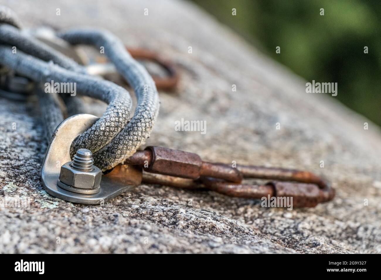 Closeup shot of a rope attached to the rock for rock climbing in Ticino ...