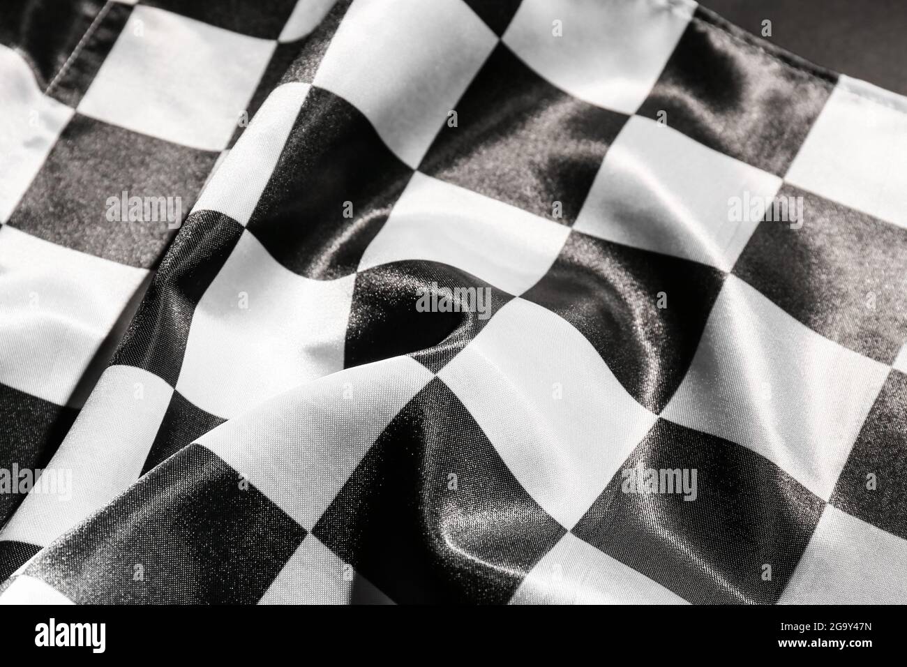 Racing flag as background, closeup Stock Photo - Alamy
