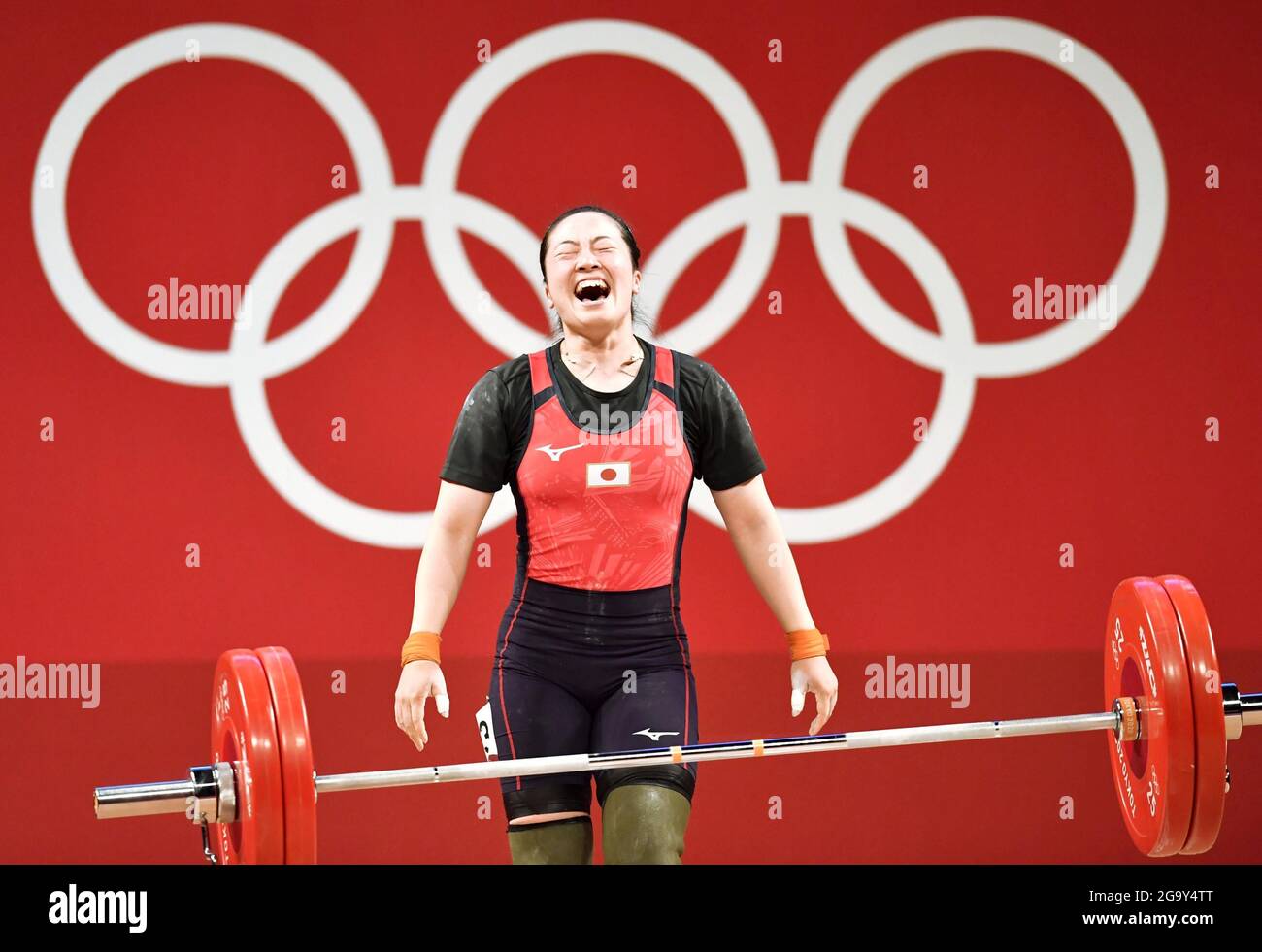 Japan's Mikiko Andoh reacts after lifting 120 kilograms in the jerk ...