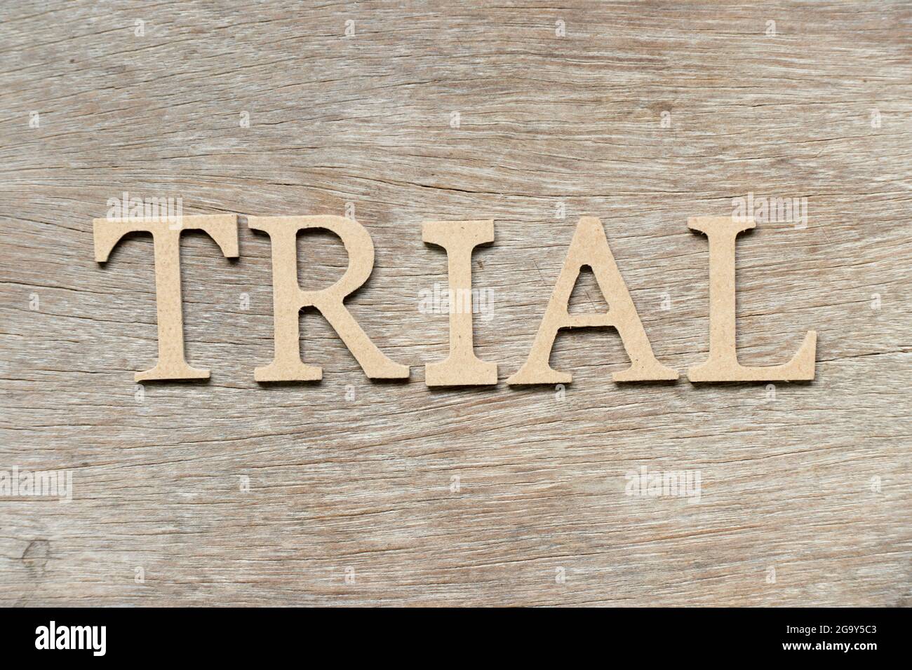 Alphabet letter in word trial on wood background Stock Photo - Alamy