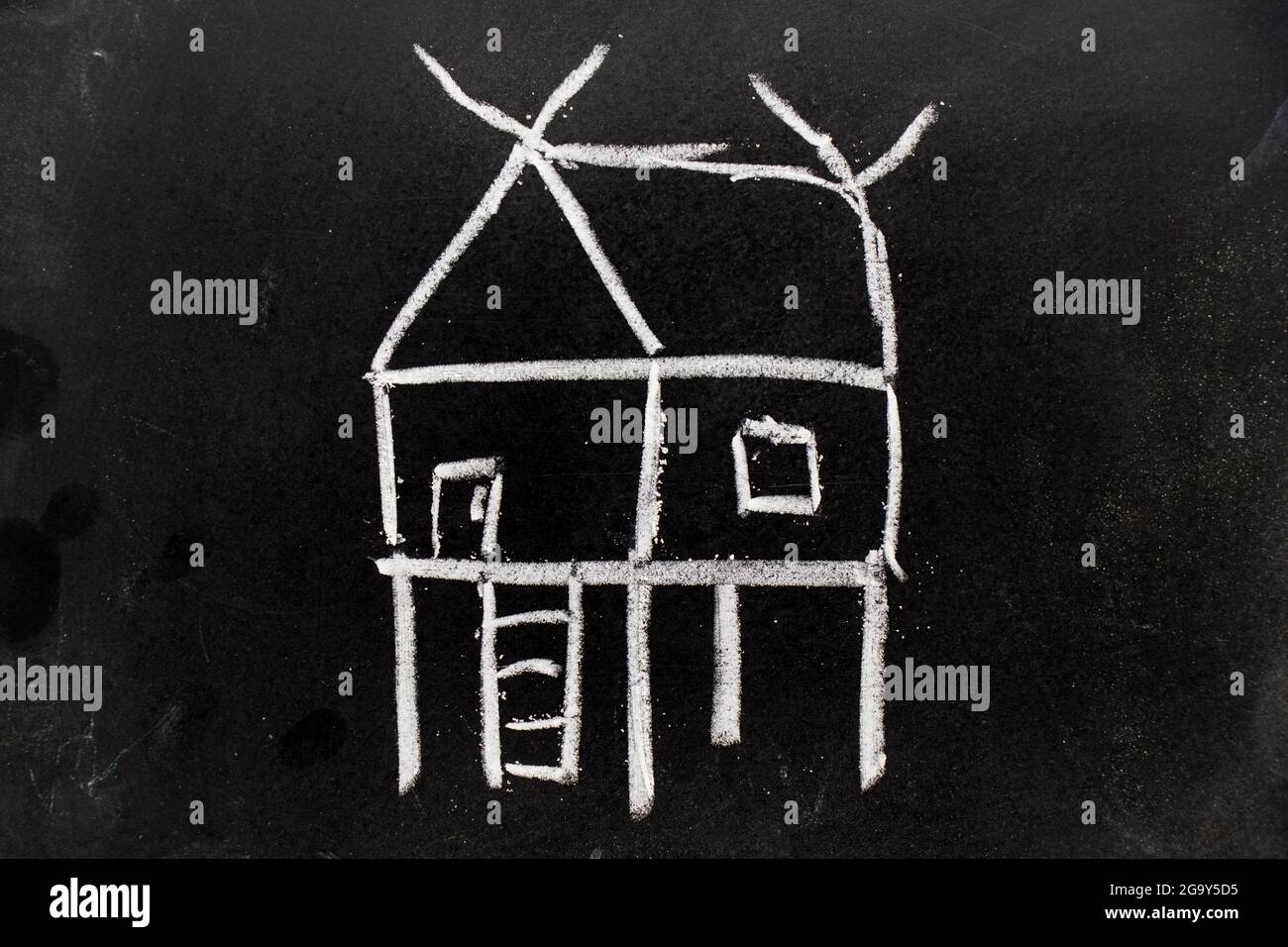 CHalk hand drawing as home shape on black board background Stock Photo ...