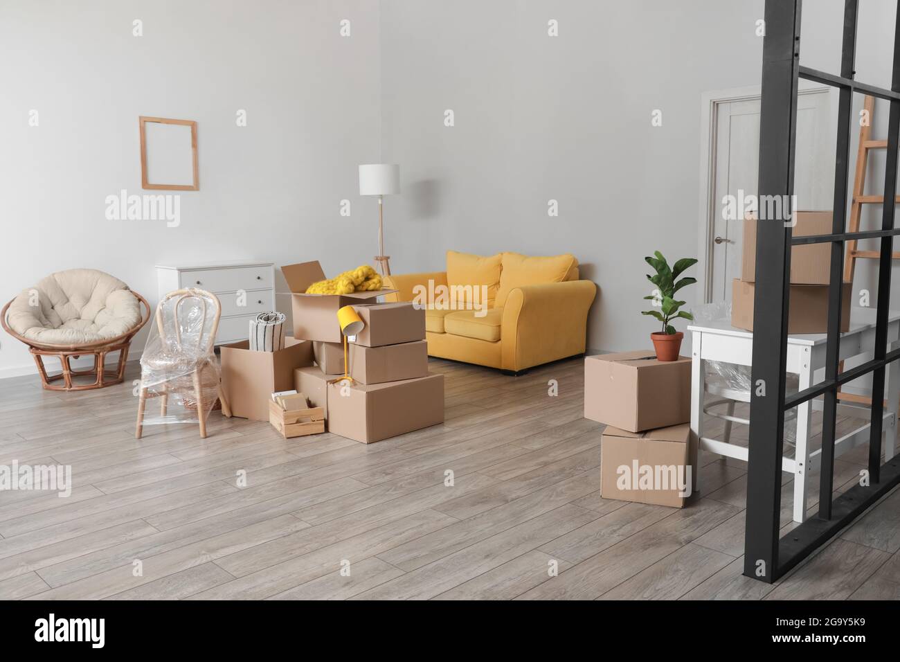 Cardboard boxes with belongings in room on moving day Stock Photo - Alamy