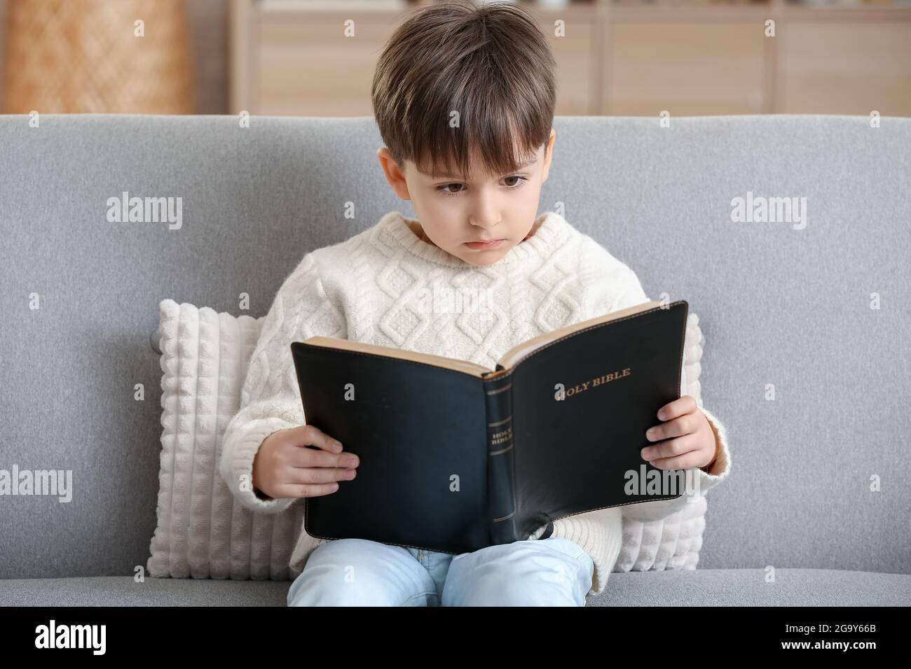Boy reading bible hi-res stock photography and images - Alamy