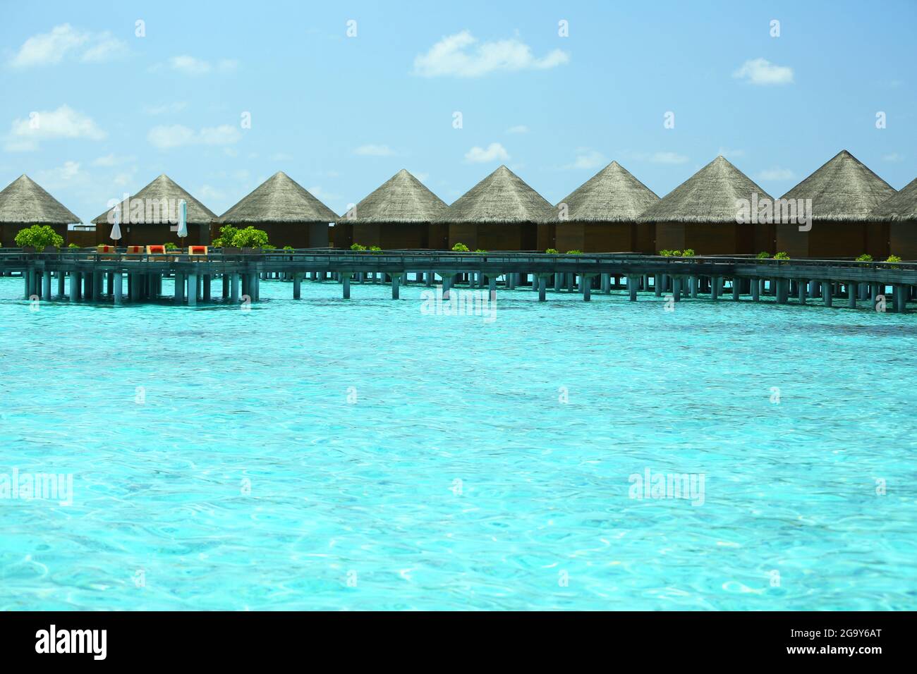 Water villas over ocean background Stock Photo - Alamy