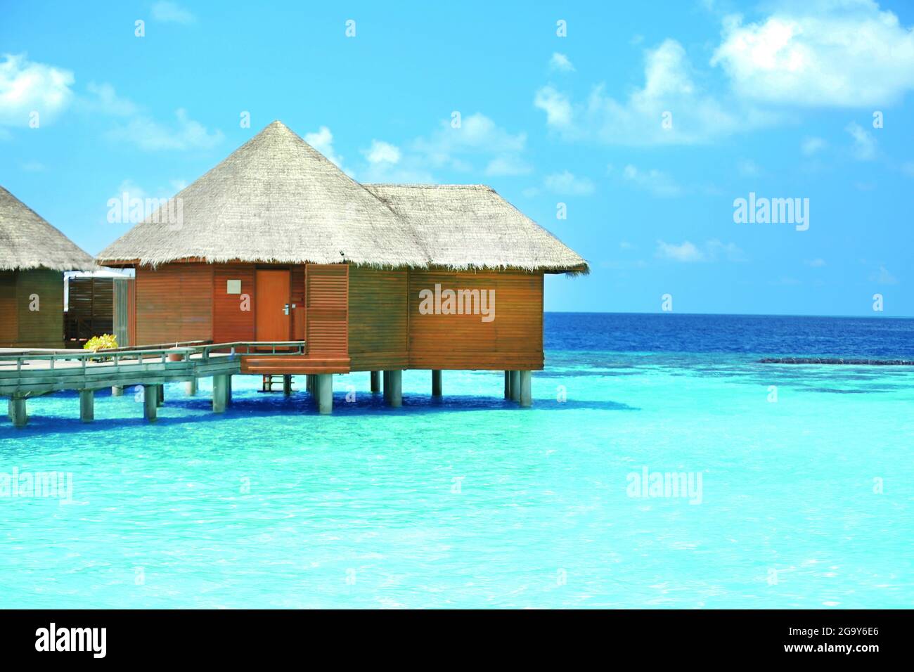 Water villas over ocean background Stock Photo - Alamy