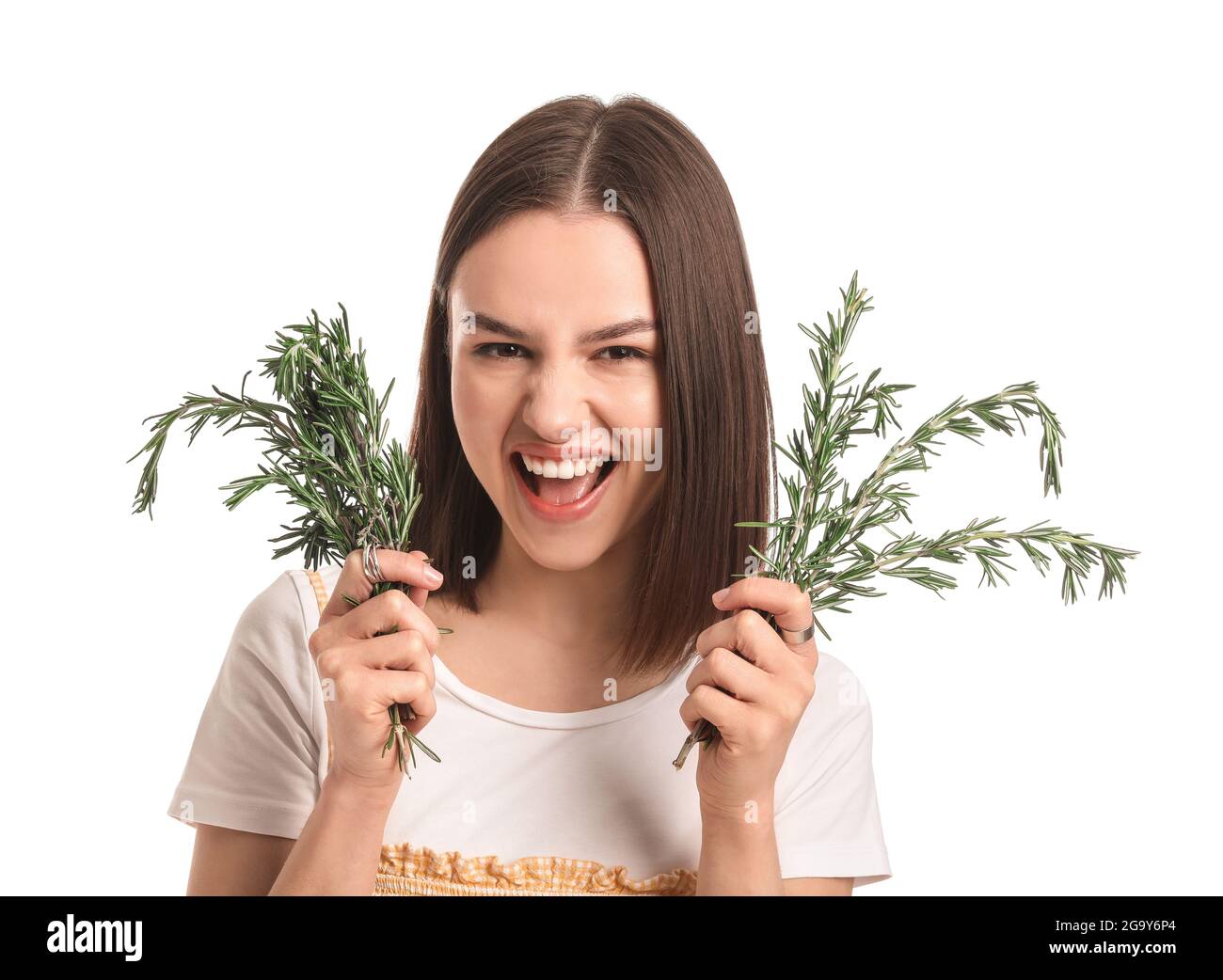 Young woman with rosemary on white background Stock Photo - Alamy