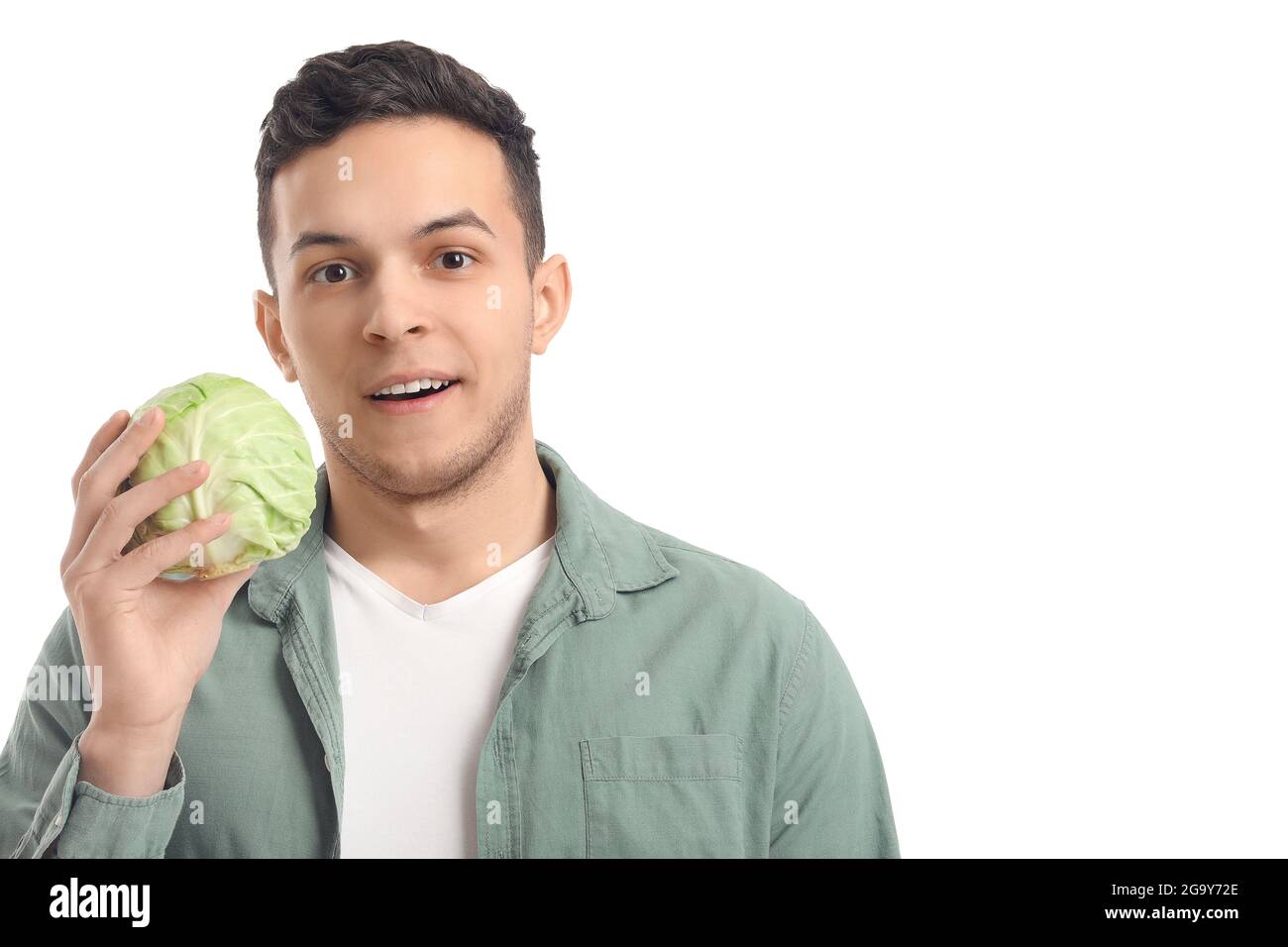 Surprised young man with fresh cabbage on white background Stock Photo ...