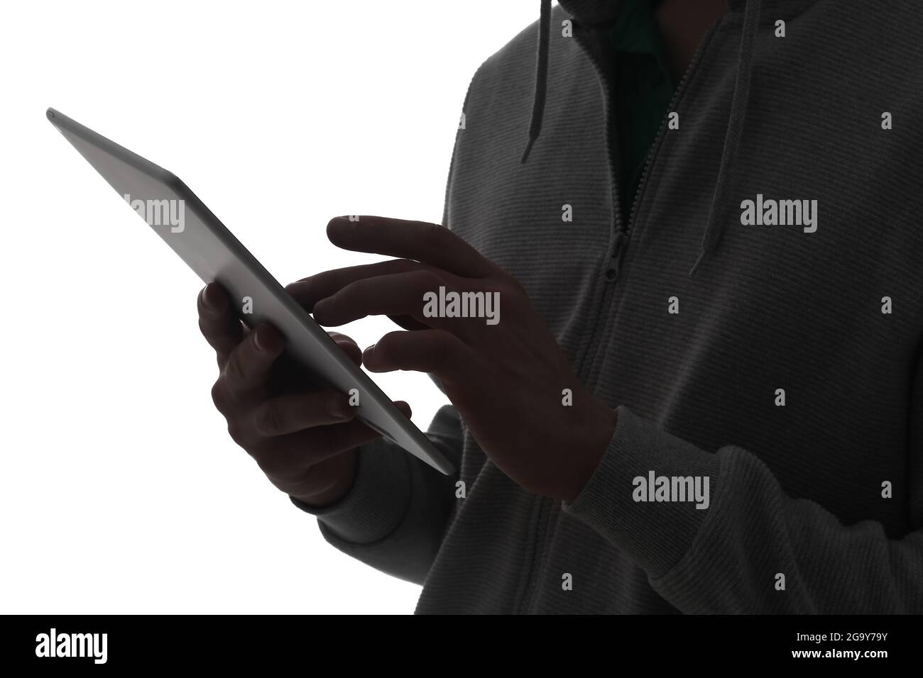 Silhouette of hacker with tablet computer on white background, closeup ...
