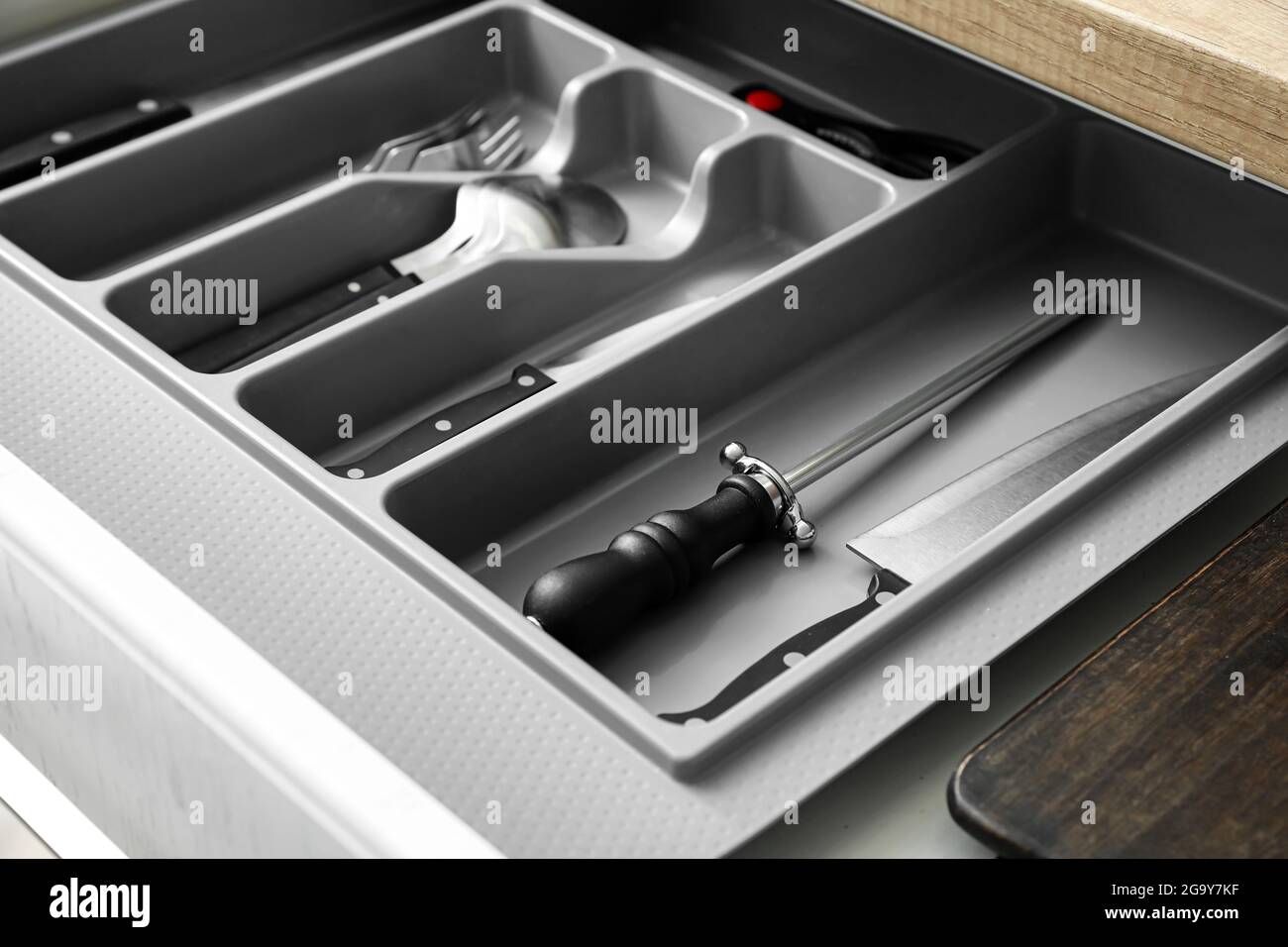 Drawer with set of knives in kitchen Stock Photo - Alamy