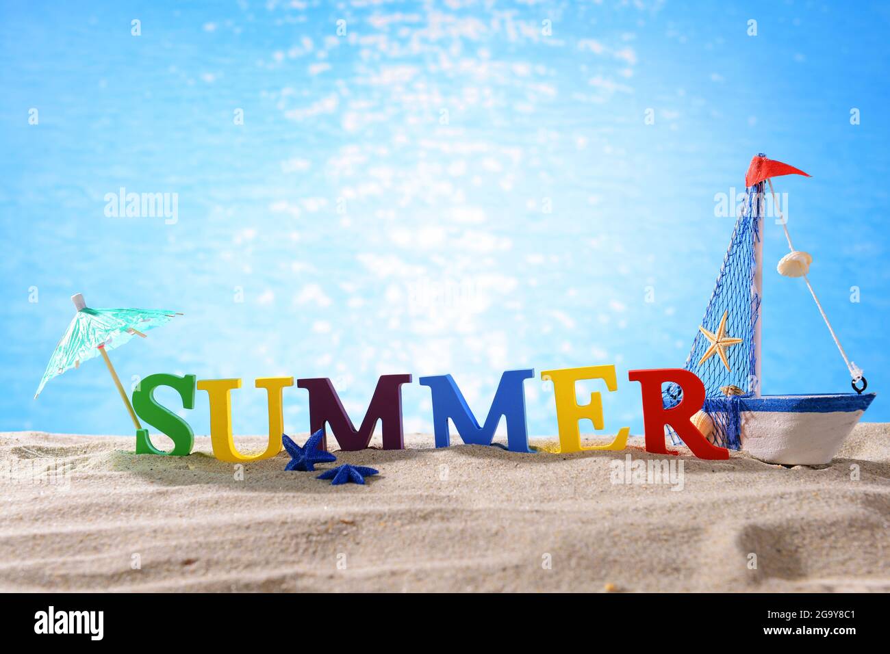 Word summer on beach sand Stock Photo - Alamy