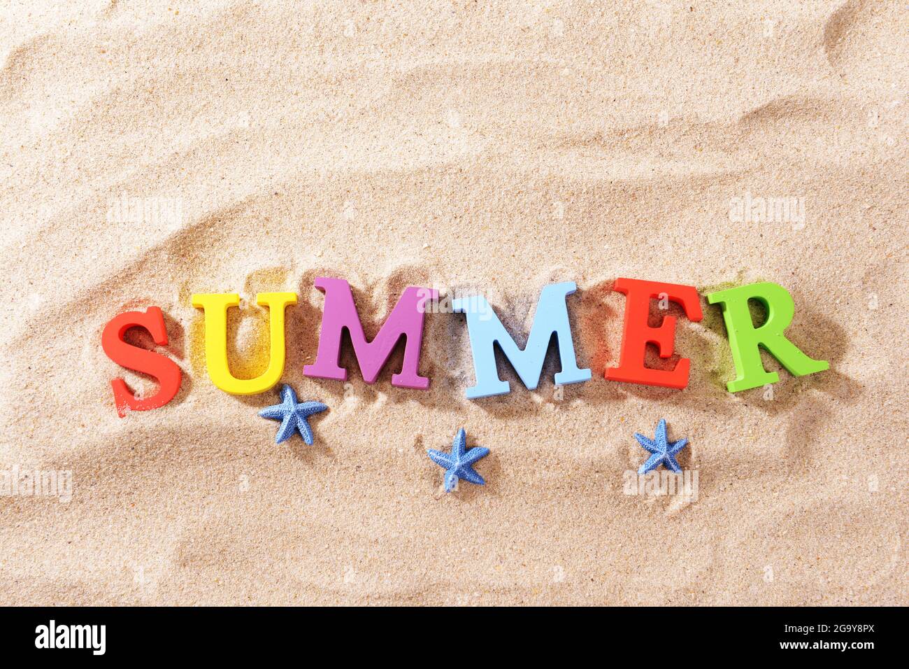Word summer on beach background Stock Photo - Alamy