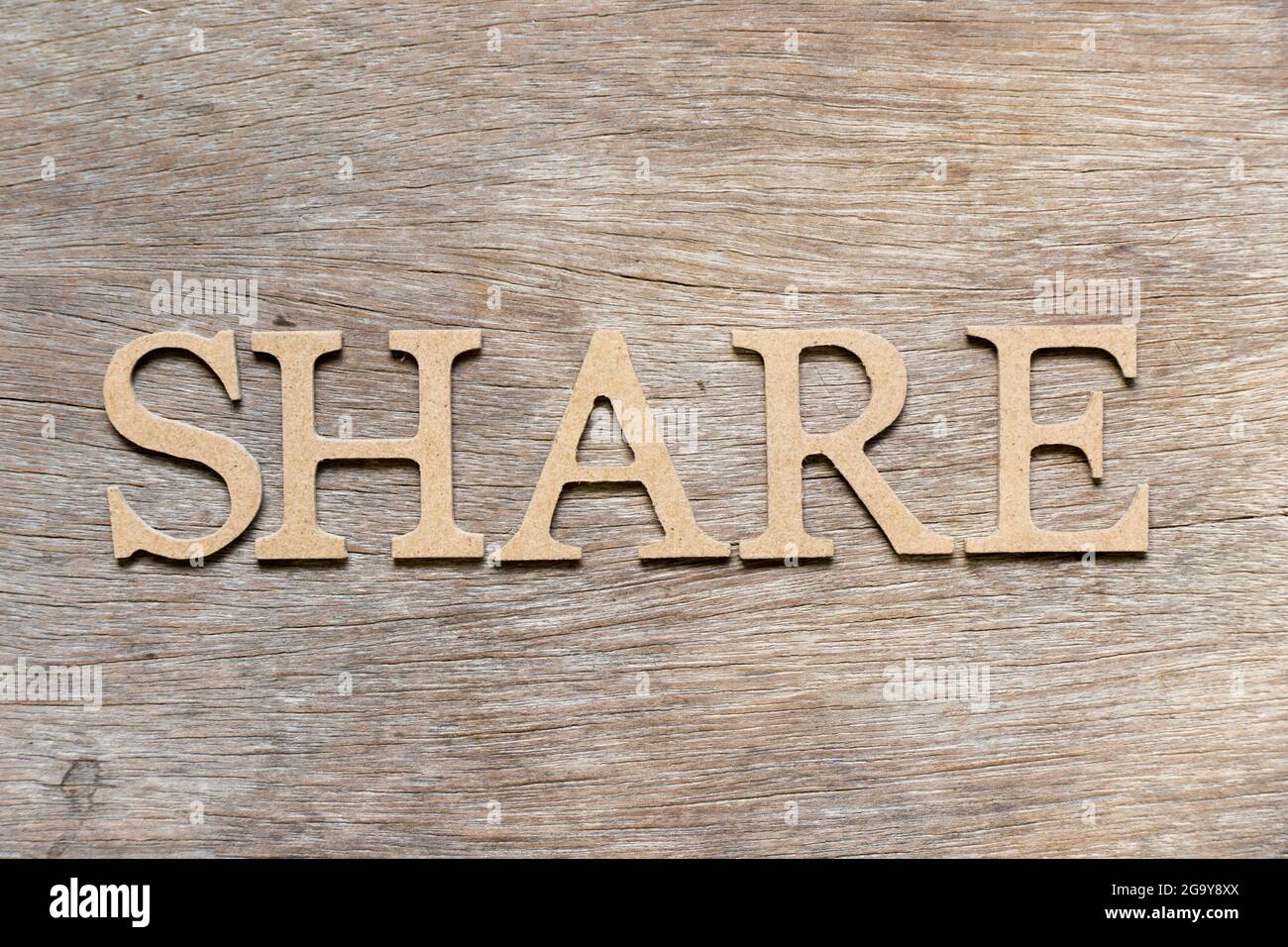 Alphabet letter in word share on wood background Stock Photo - Alamy