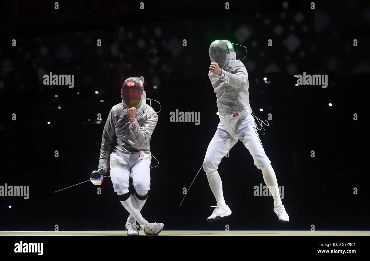 Tokyo, Japan. 28th July, 2021. Gu Bongil (R) of South Korea scores from ...