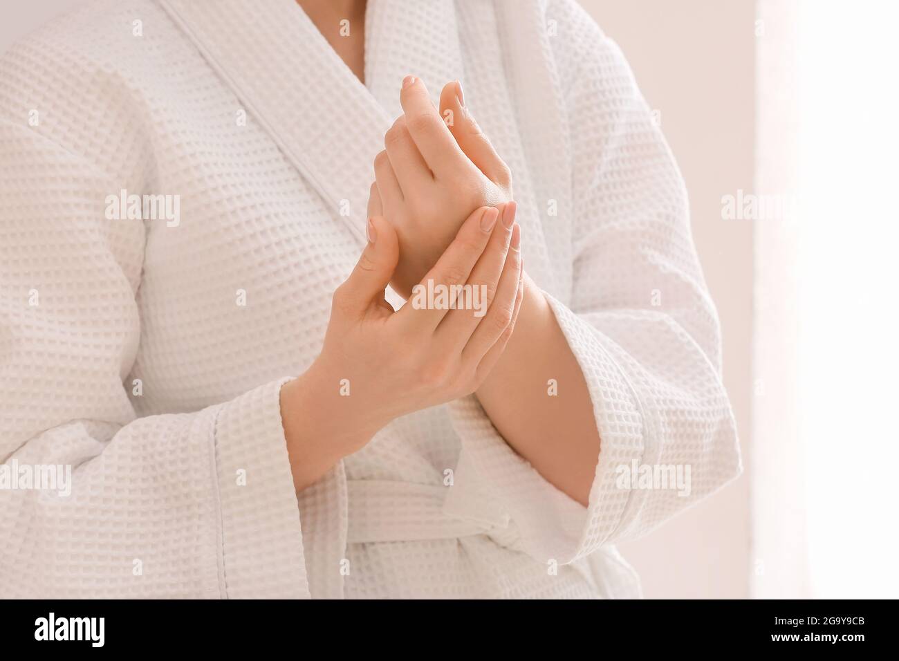 Woman applying shea butter onto hands, closeup Stock Photo - Alamy