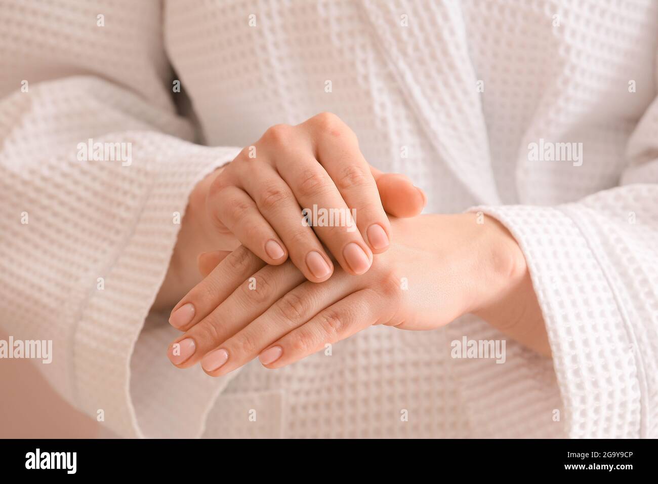 Woman applying shea butter onto hands, closeup Stock Photo - Alamy