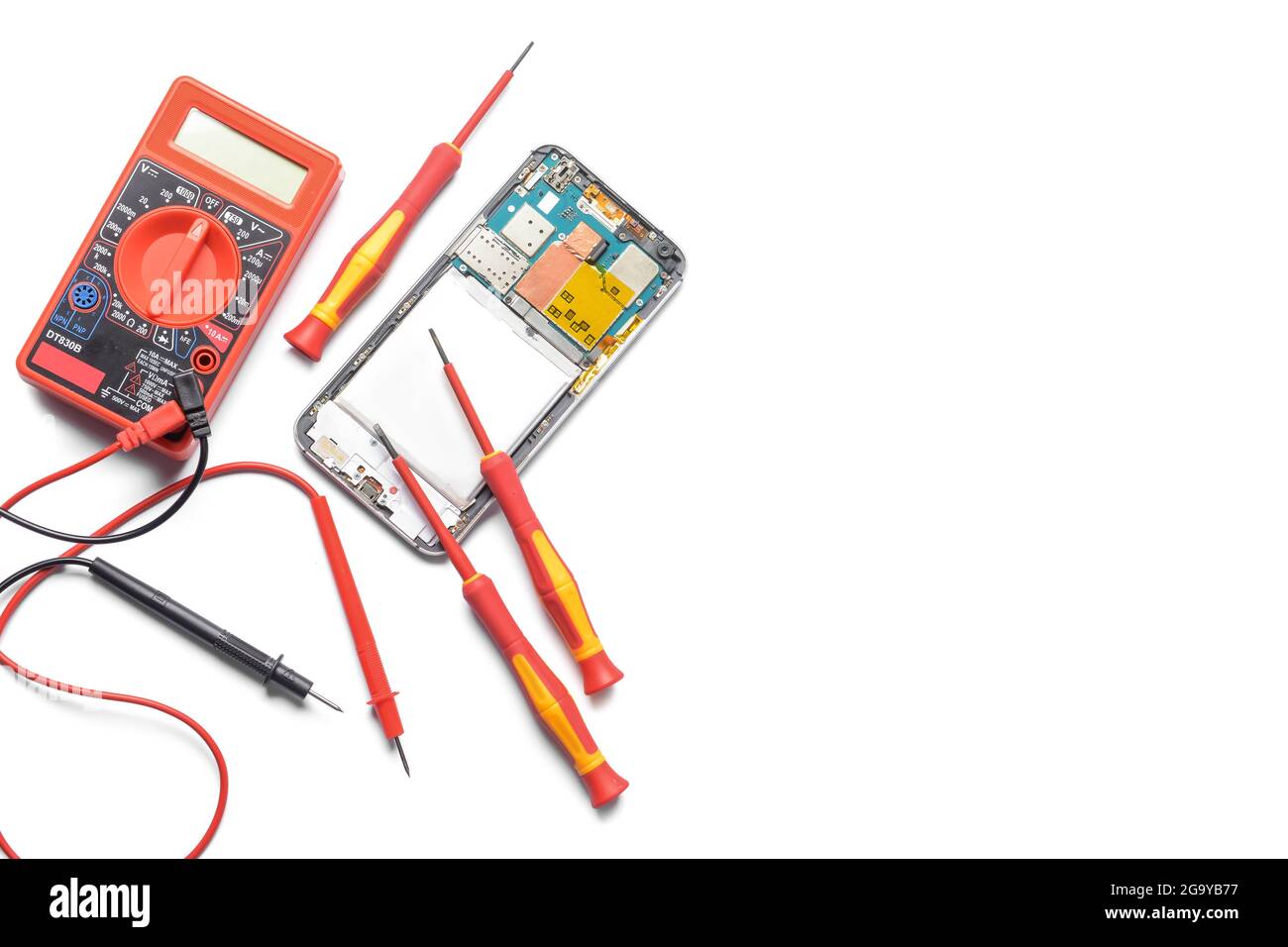 Disassembled mobile phone with multimeter on white background Stock ...