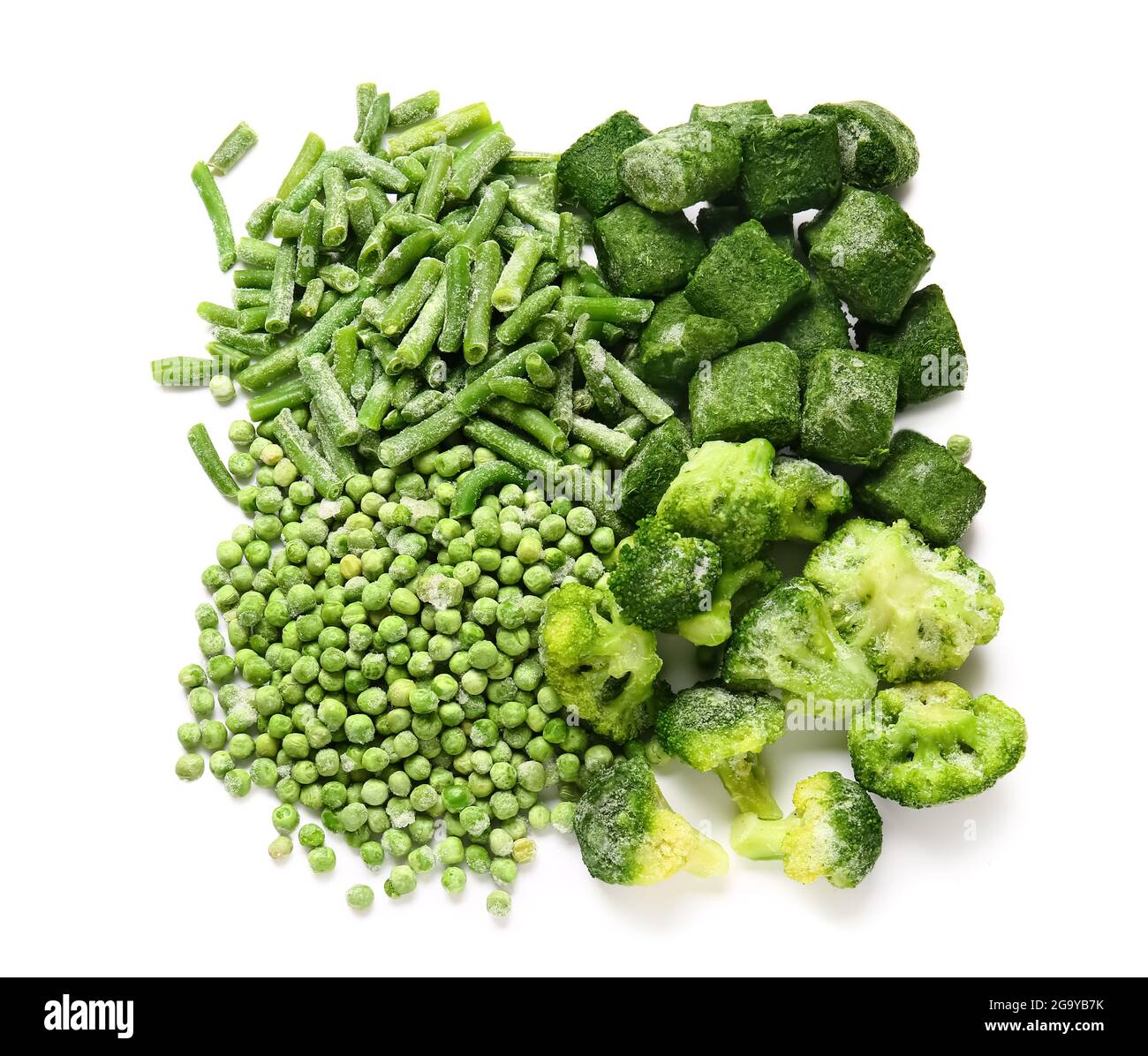Frozen green vegetables on white background Stock Photo - Alamy