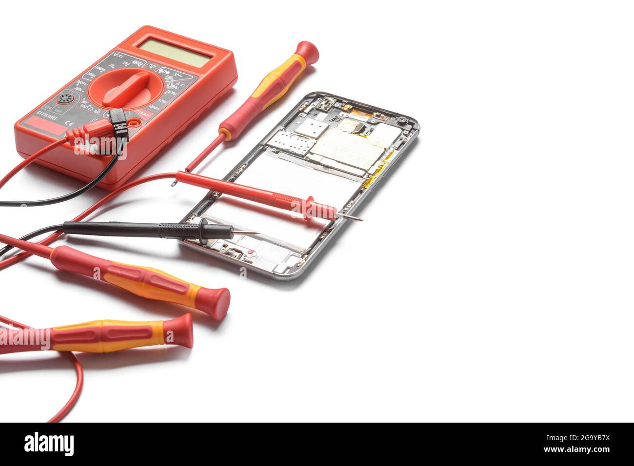 Disassembled mobile phone with multimeter on white background Stock ...