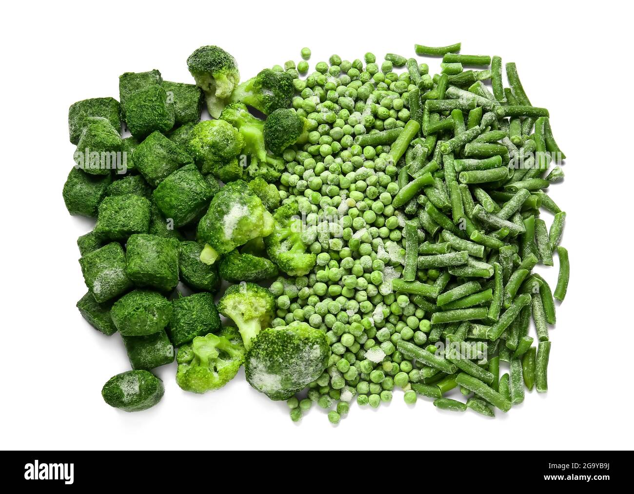 Frozen green vegetables on white background Stock Photo - Alamy