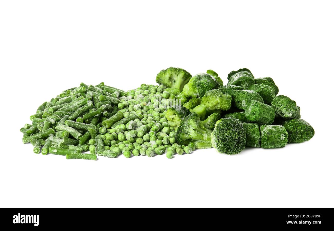 Frozen green vegetables on white background Stock Photo - Alamy