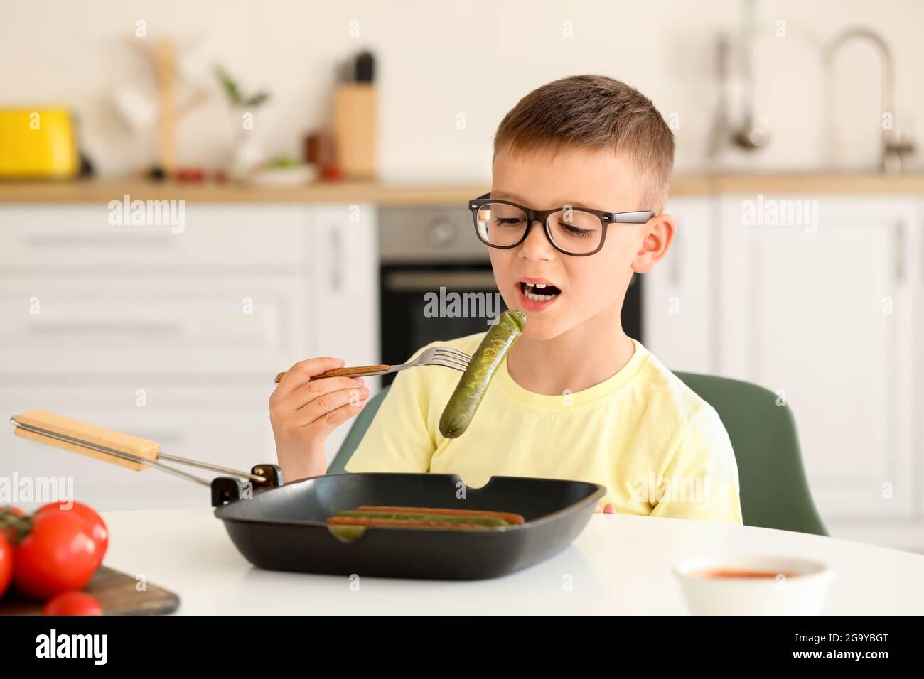 Child eating pork meat hi-res stock photography and images - Alamy