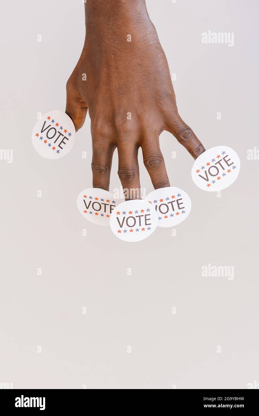 Vote stickers on person s fingers down in white background Stock Photo ...