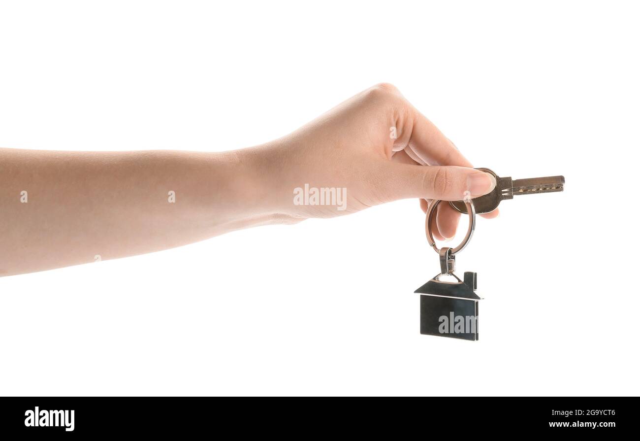 Hand with key on white background Stock Photo - Alamy