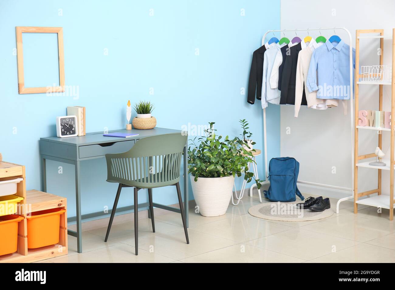 Interior of stylish room with modern workplace and school uniform Stock ...